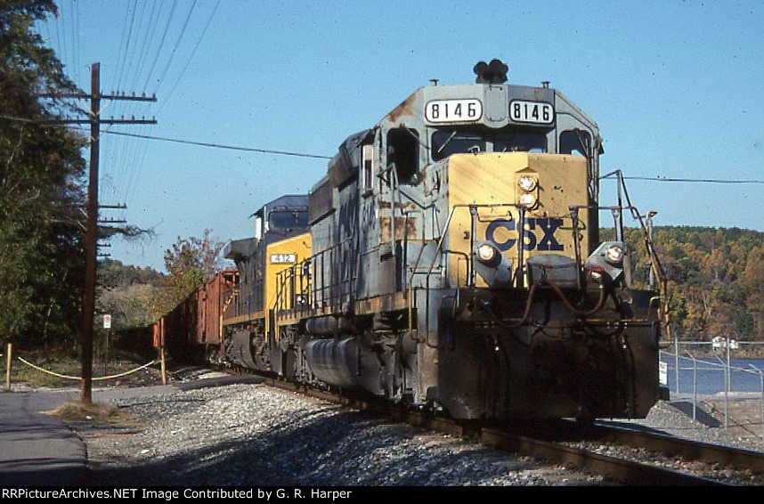 CSX 8146 leads a ballast train